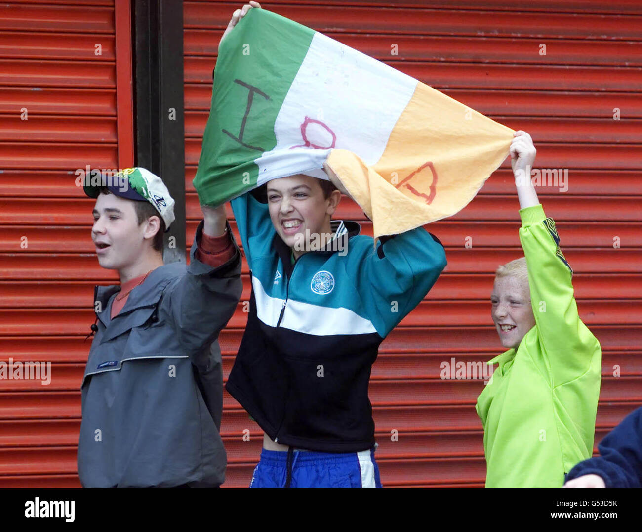 Children holds up an Irish tri-colour, as members of the Apprentice ...