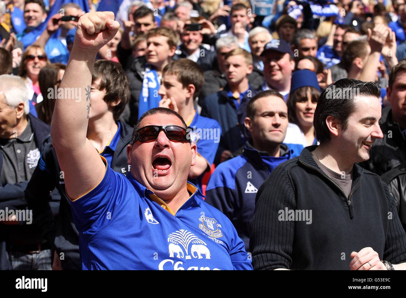 An Everton fan shows support for his team in the stands Stock Photo - Alamy