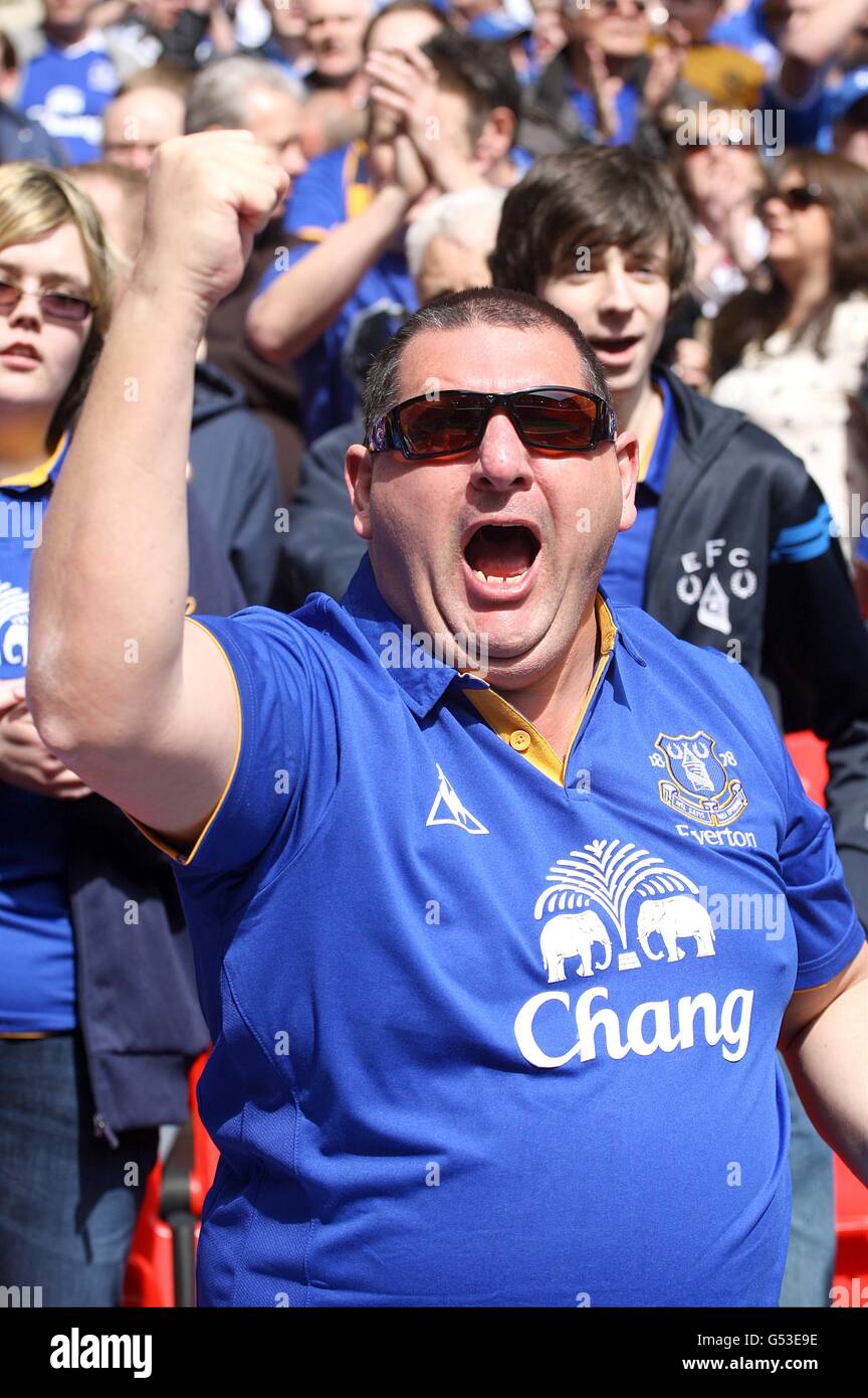 An Everton fan shows support for his team in the stands Stock Photo - Alamy