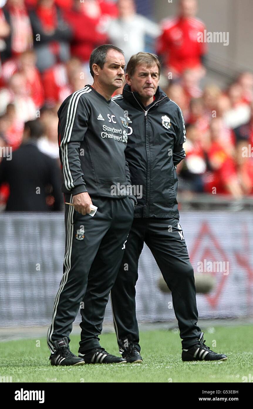 Liverpool manager Kenny Dalglish (right) with first team coach Steve ...