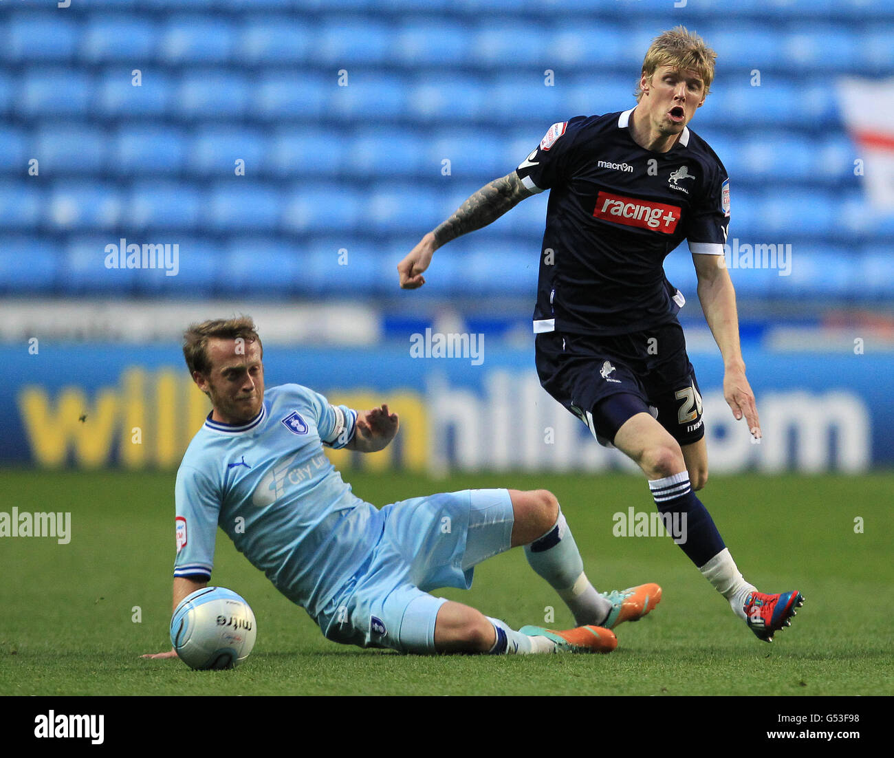 Coventry citys sammy clingan left tackles millwalls andy keogh hi-res ...