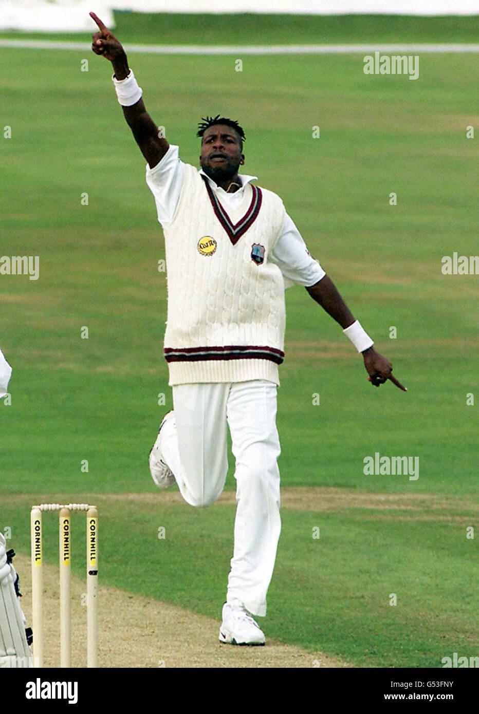 West Indian fast bowler Curtly Ambrose celebrates the wicket of England ...