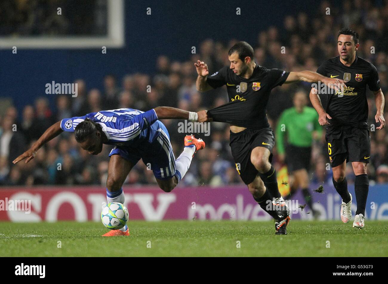Chelseas didier left barcelonas javier mascherano battle for the ball ...