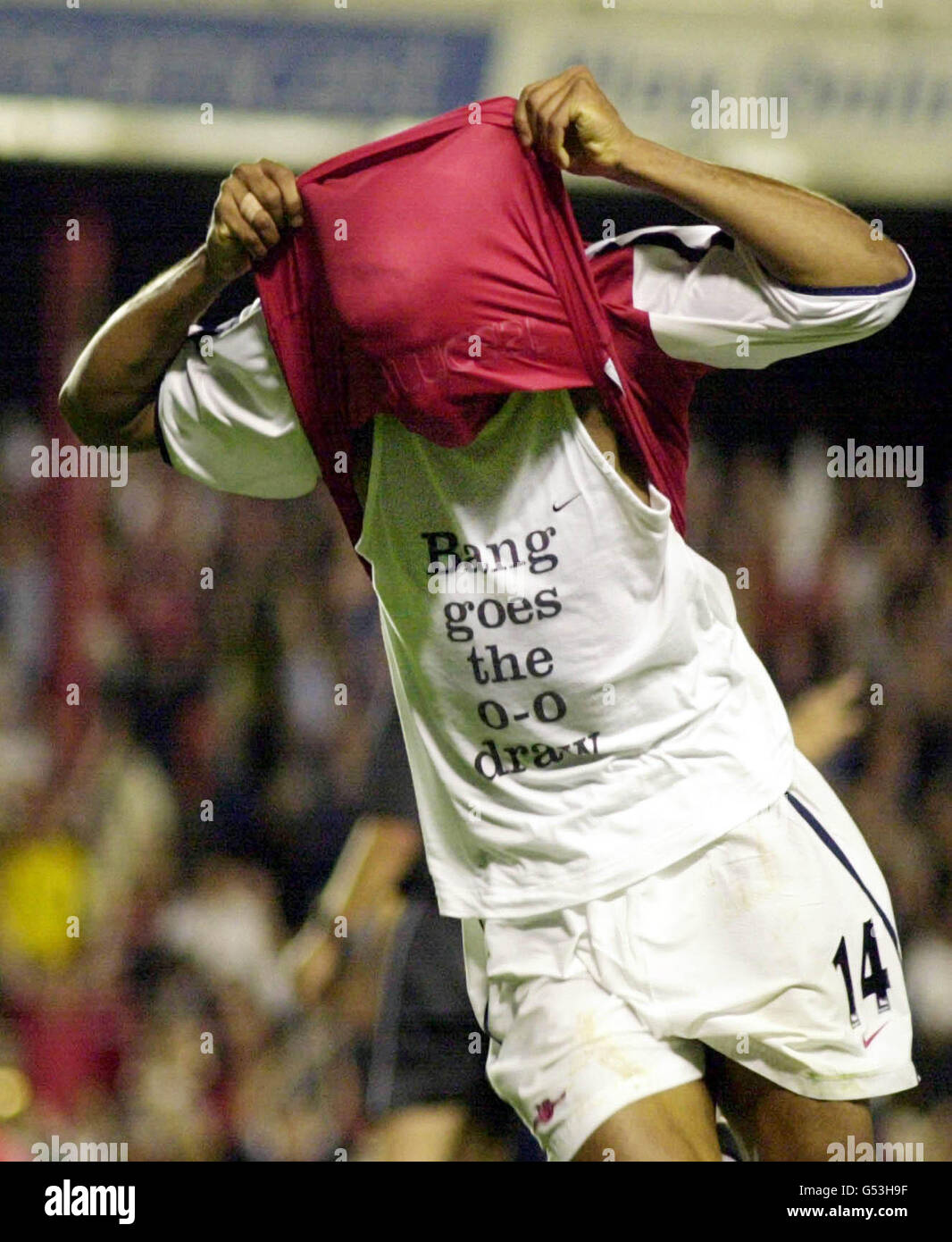 Football shirt over head football celebration hi-res stock photography ...