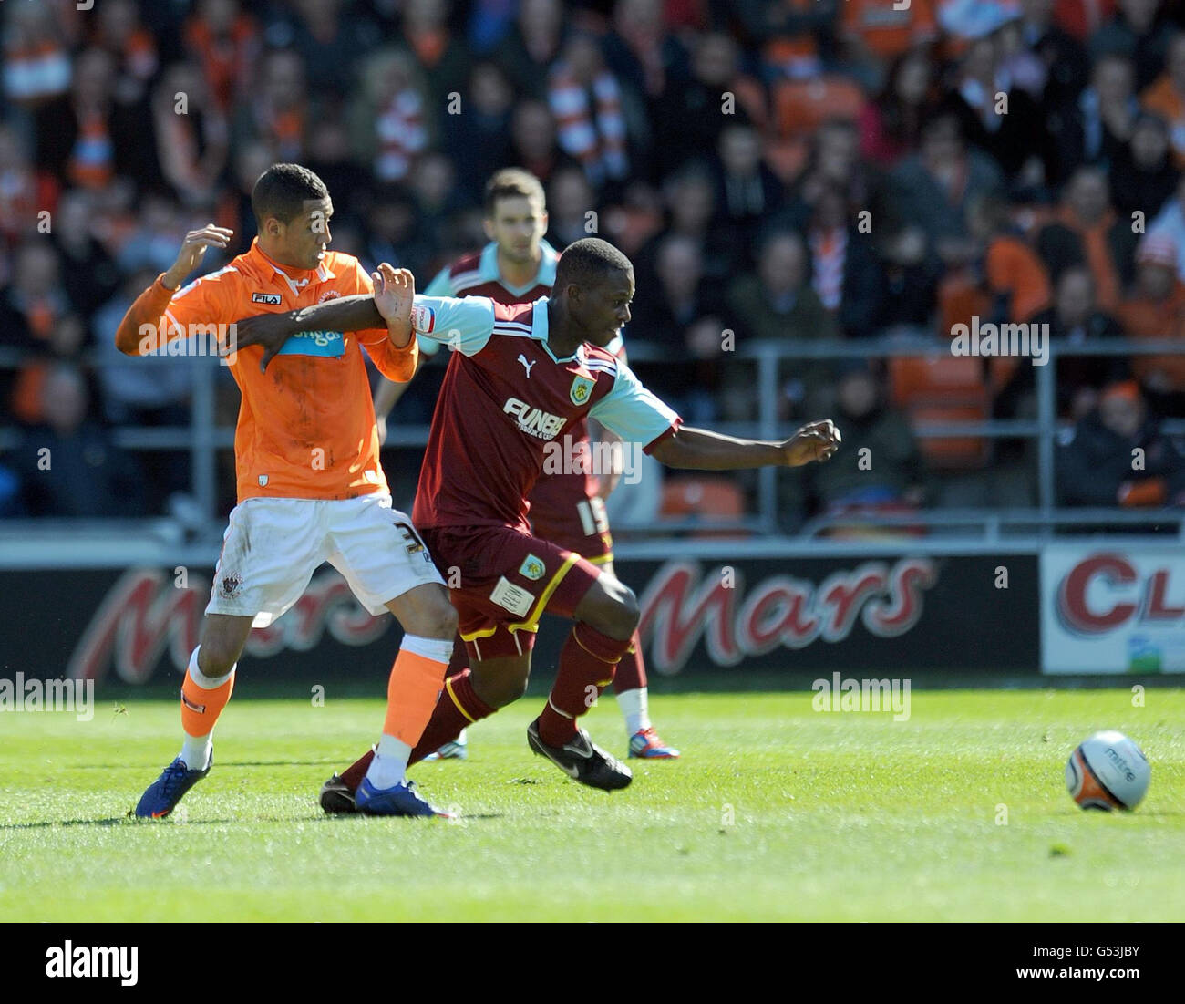 Blackpool's Thomas Ince (left) tackles Burnley's Marvin Bartley during ...