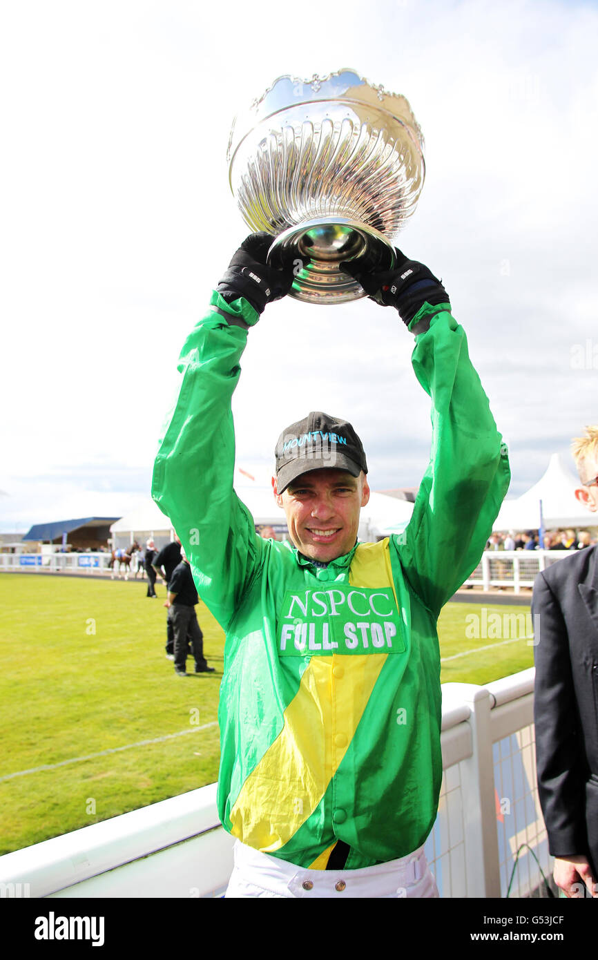 Jockey Timmy Murphy celebrates winning the Coral Scottish Grand ...