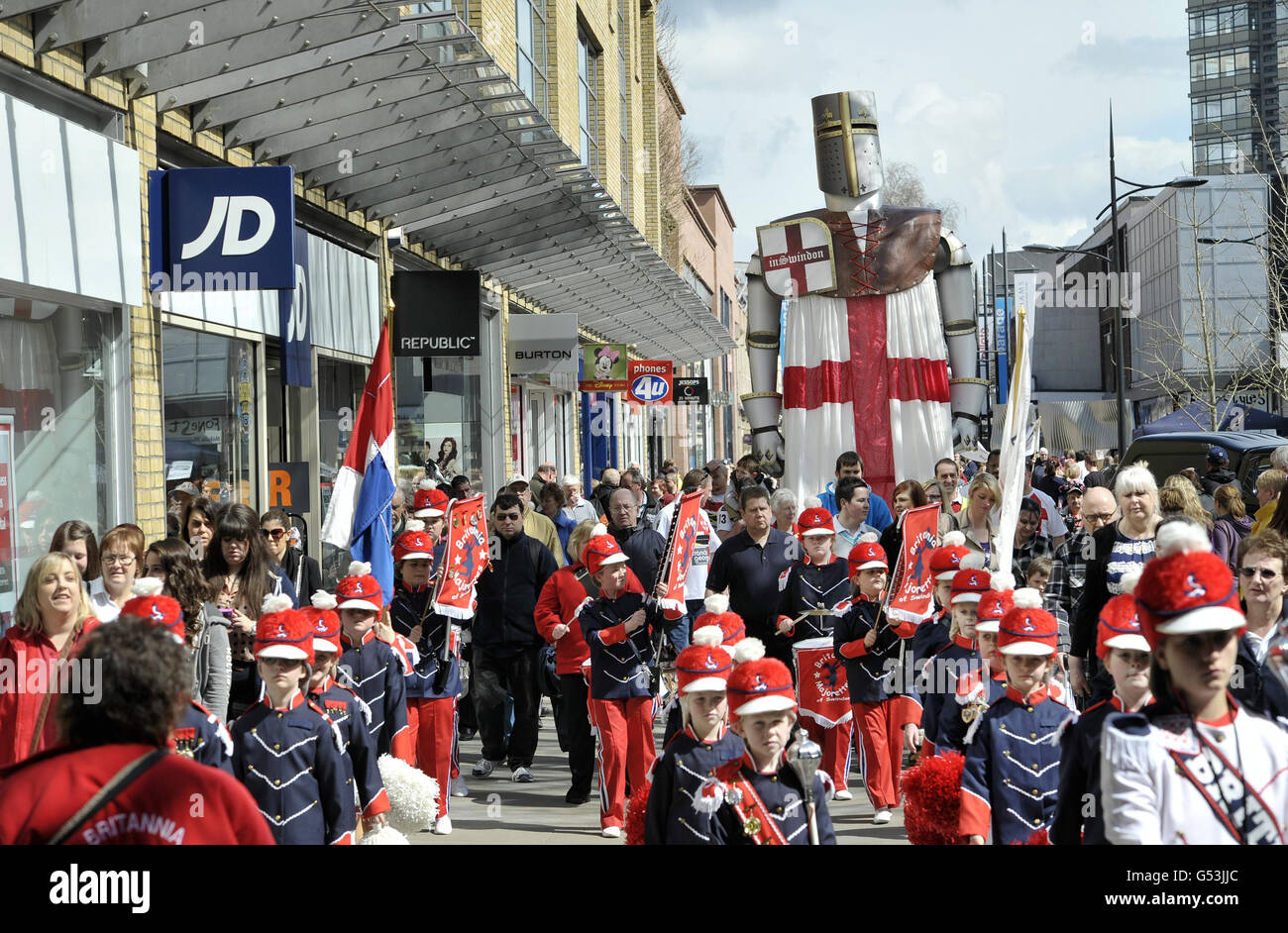 A 20ft model of the patron saint St George is paraded through Swindon ...