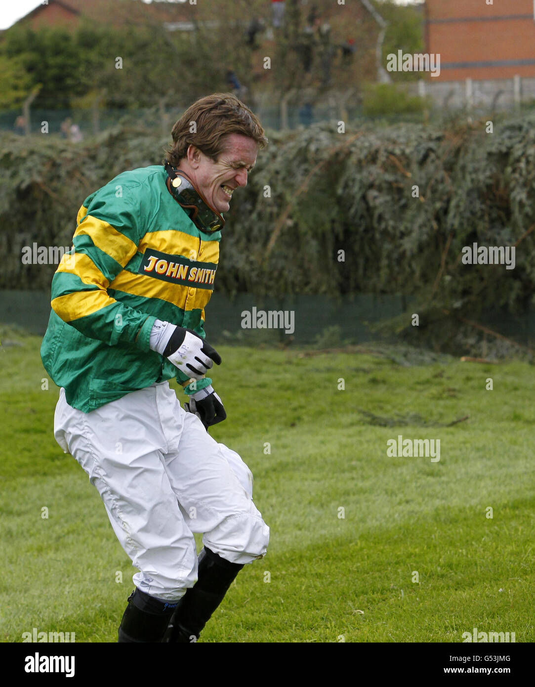 AP McCoy looks injured after he falls at Bechers in the Grand National ...