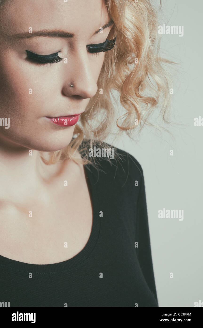 Beautiful woman looking down Stock Photo - Alamy