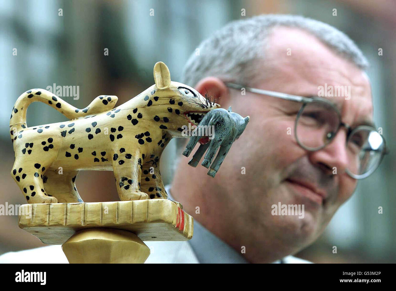 Professor John Knapton outside Newcastle University, holding a tribal ...