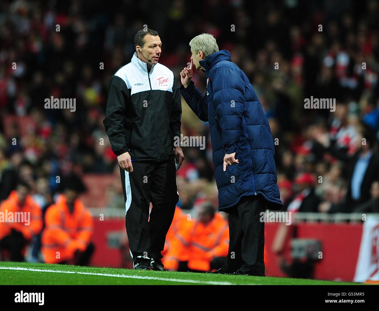 Arsenal manager Arsene Wenger shows his frustration towards the fourth ...