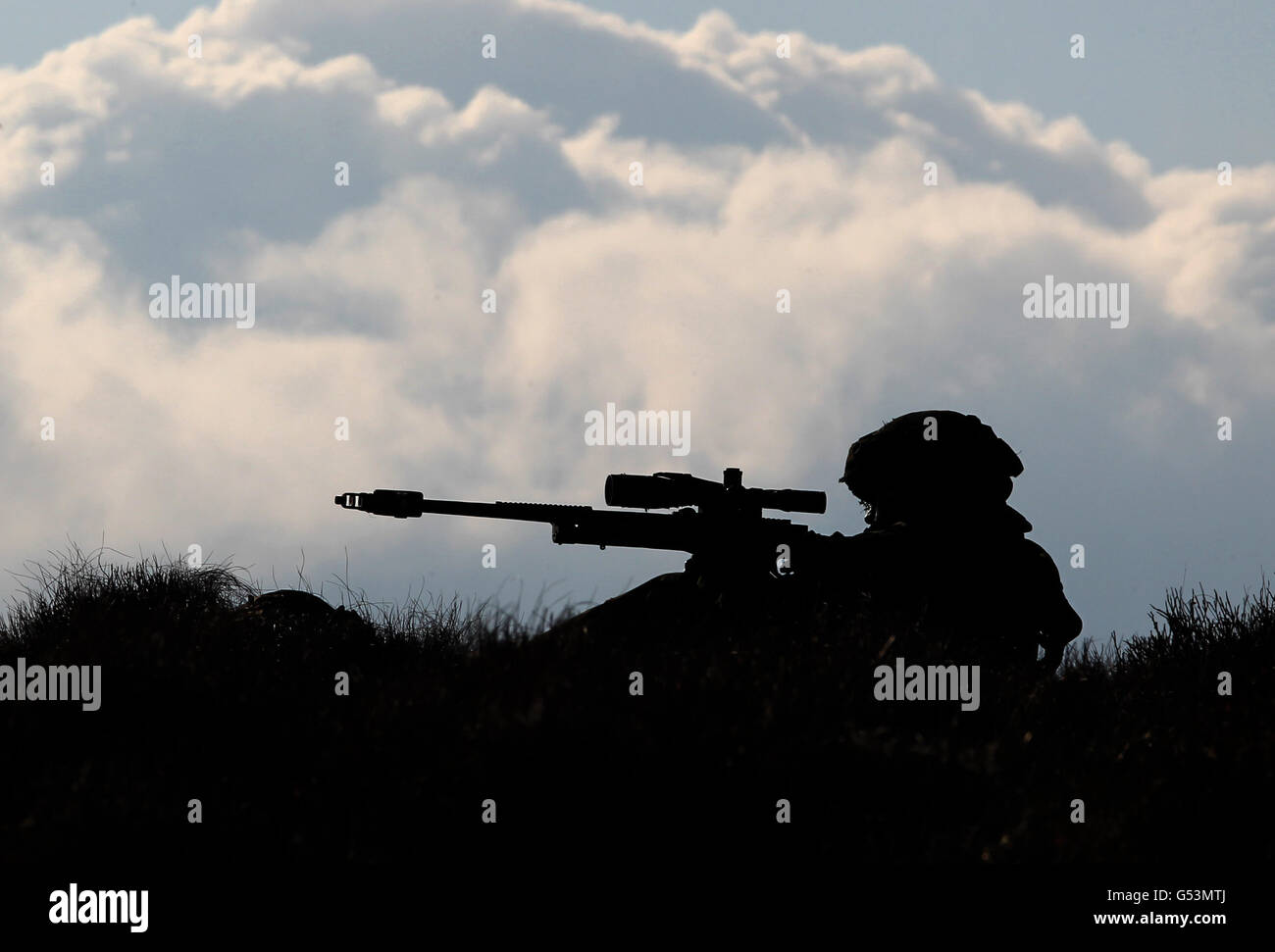 A sniper watches as Soldiers from the 16 Air Assault Brigade parachute ...