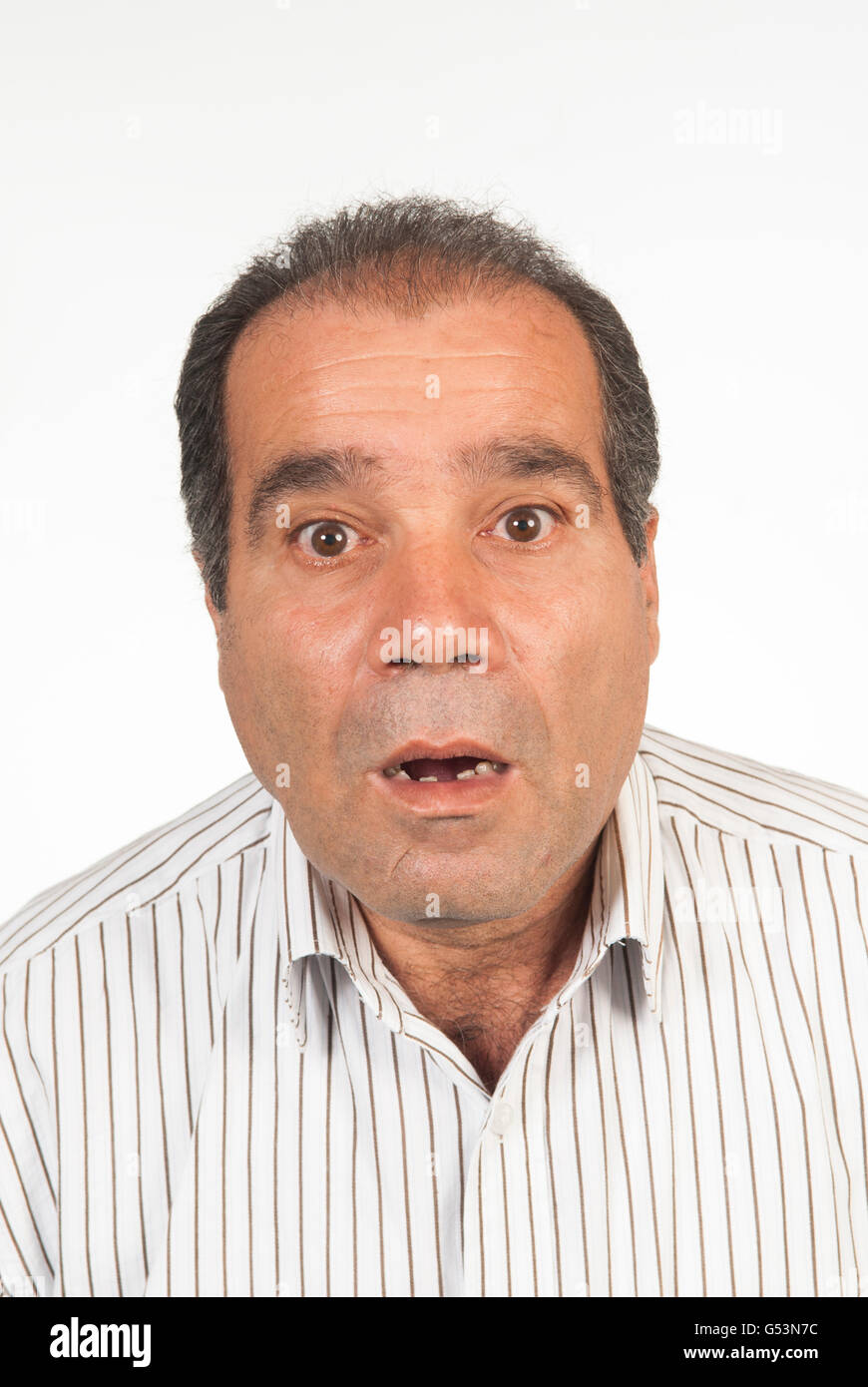 Shocked man against a white background Stock Photo - Alamy