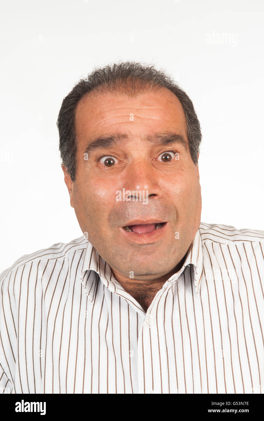Shocked man against a white background Stock Photo - Alamy