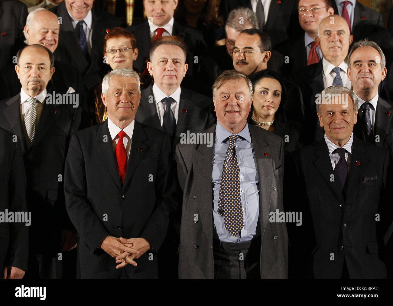Justice Secretary Kenneth Clarke stands with the 47 members of the ...