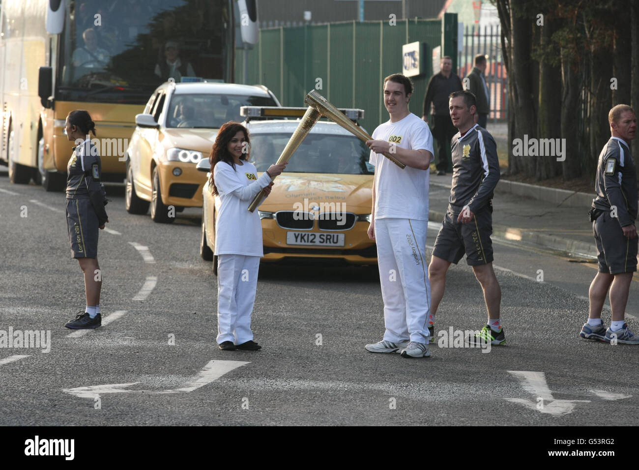Jasmine Vanmali (001) and Samuel Rowbotham (002) carry the torch from ...