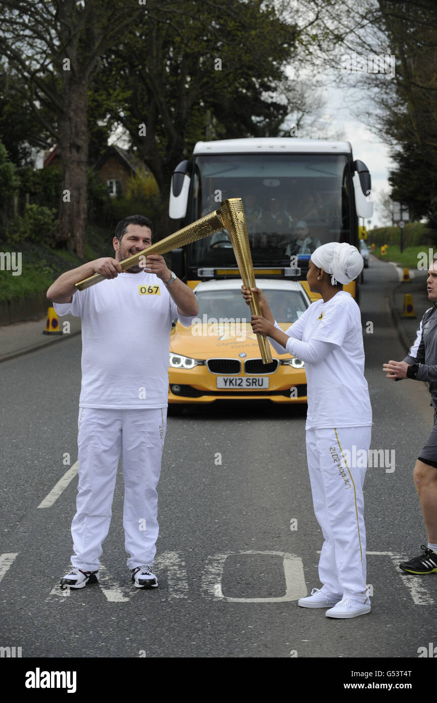 Christopher Panteli (067) passes the torch to Raina Omar (068) during ...