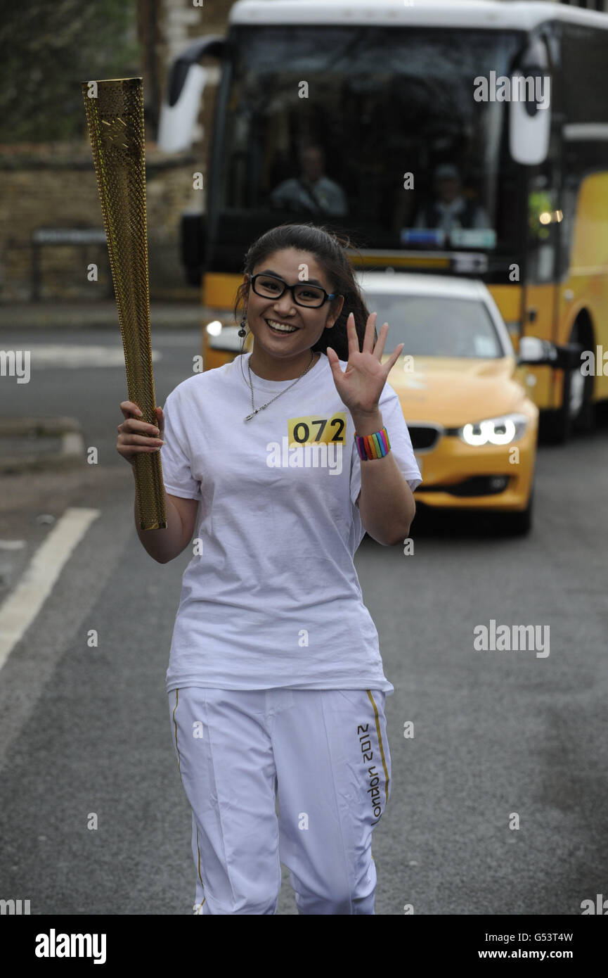 Juan Wang (072) carries the torch through Oakham during the dress ...