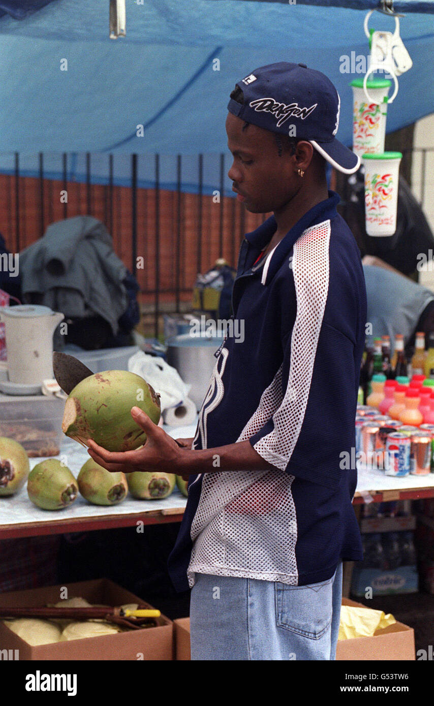 Carnival food stall. A man working on one of the food stalls at the ...