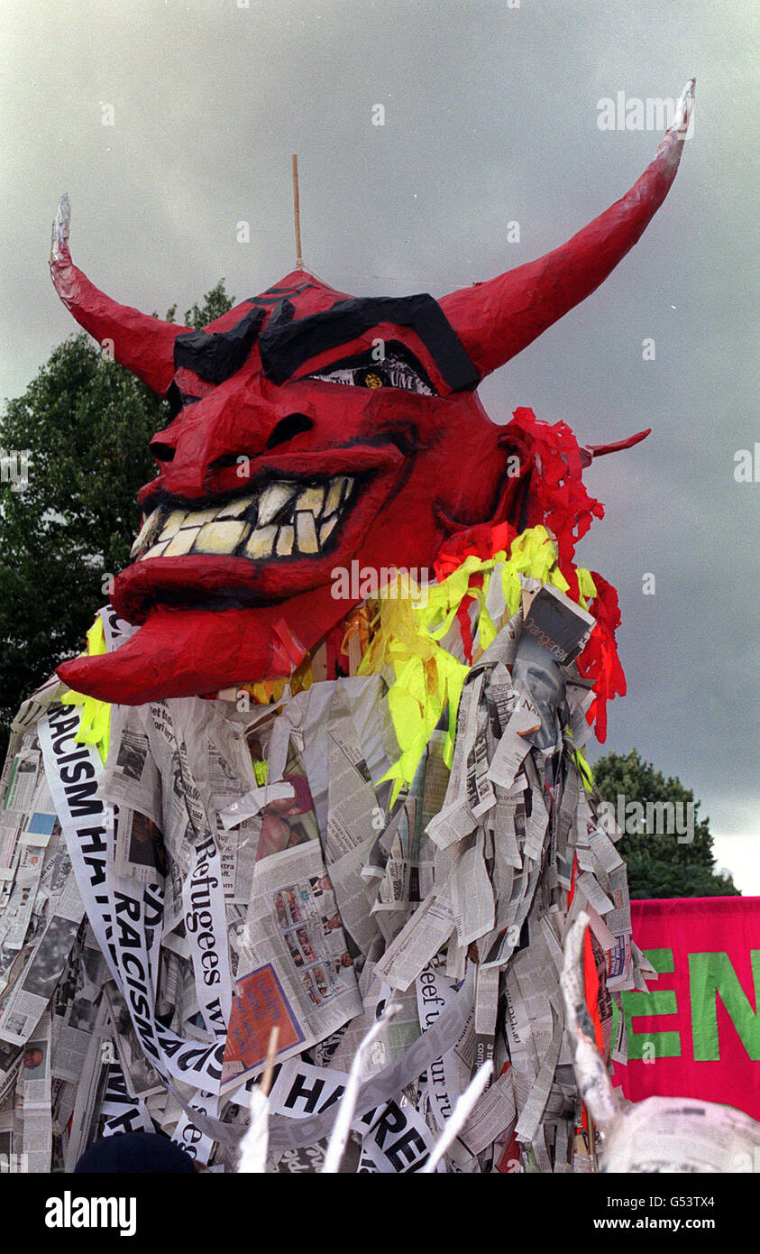 Carnival newspaper devil Stock Photo - Alamy