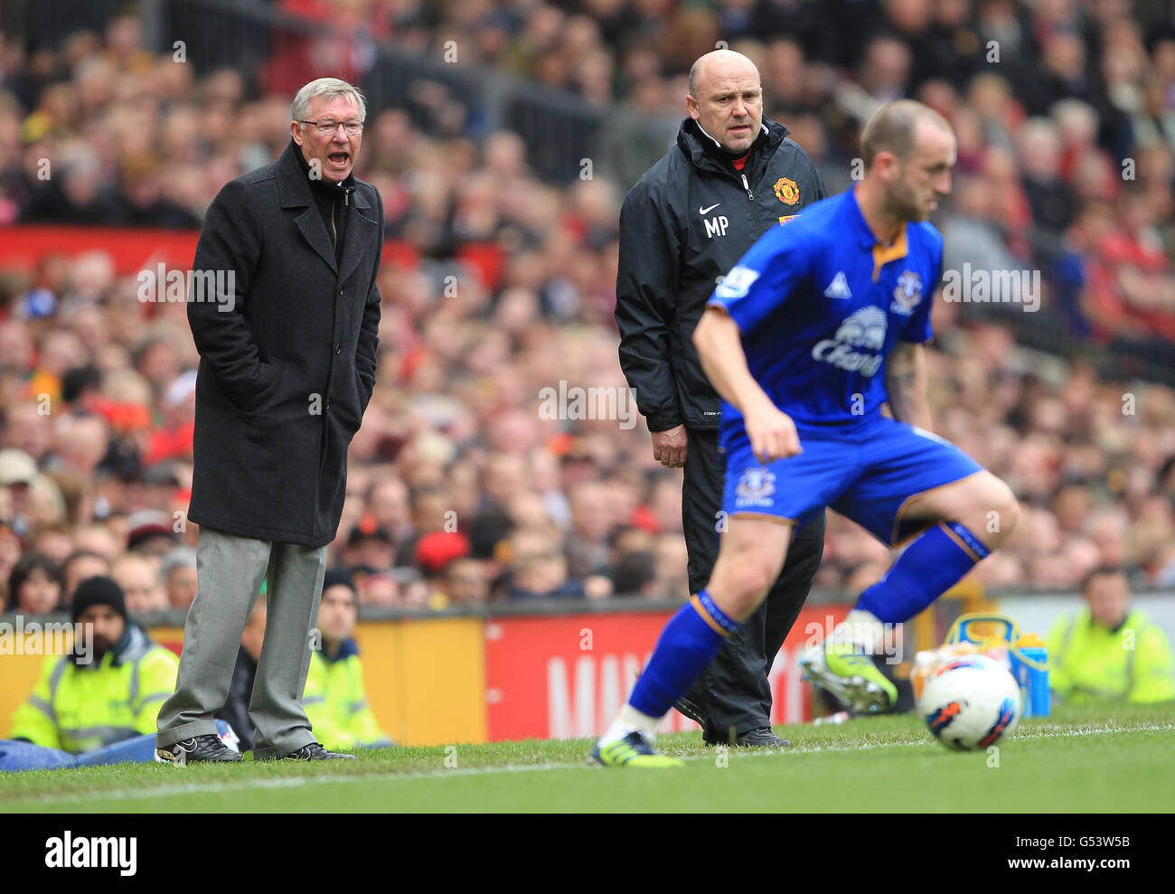 Manchester United manager Sir Alex Ferguson (left) and his assistant ...