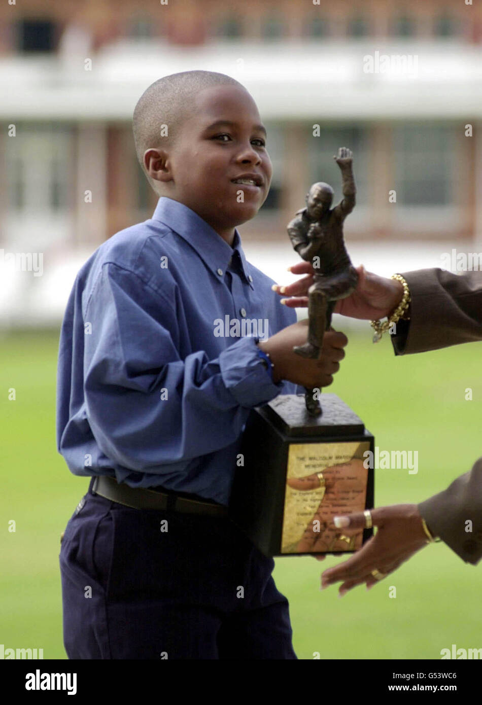 Mali Marshall, aged 10, with a 14-inch, 3 kilo bronze statuette of his ...