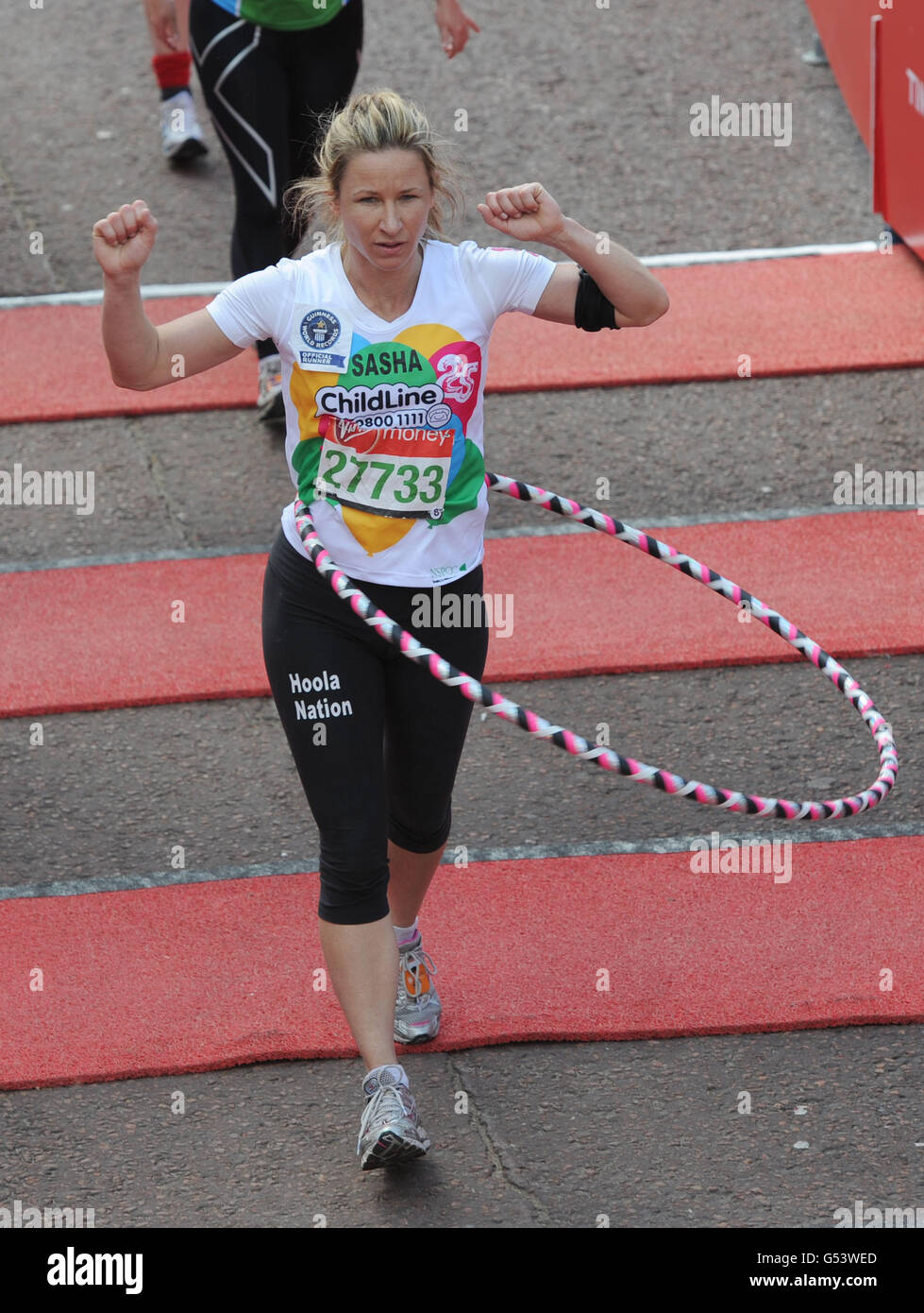 Athletics - 32nd Virgin London Marathon. A runner achieves the world ...