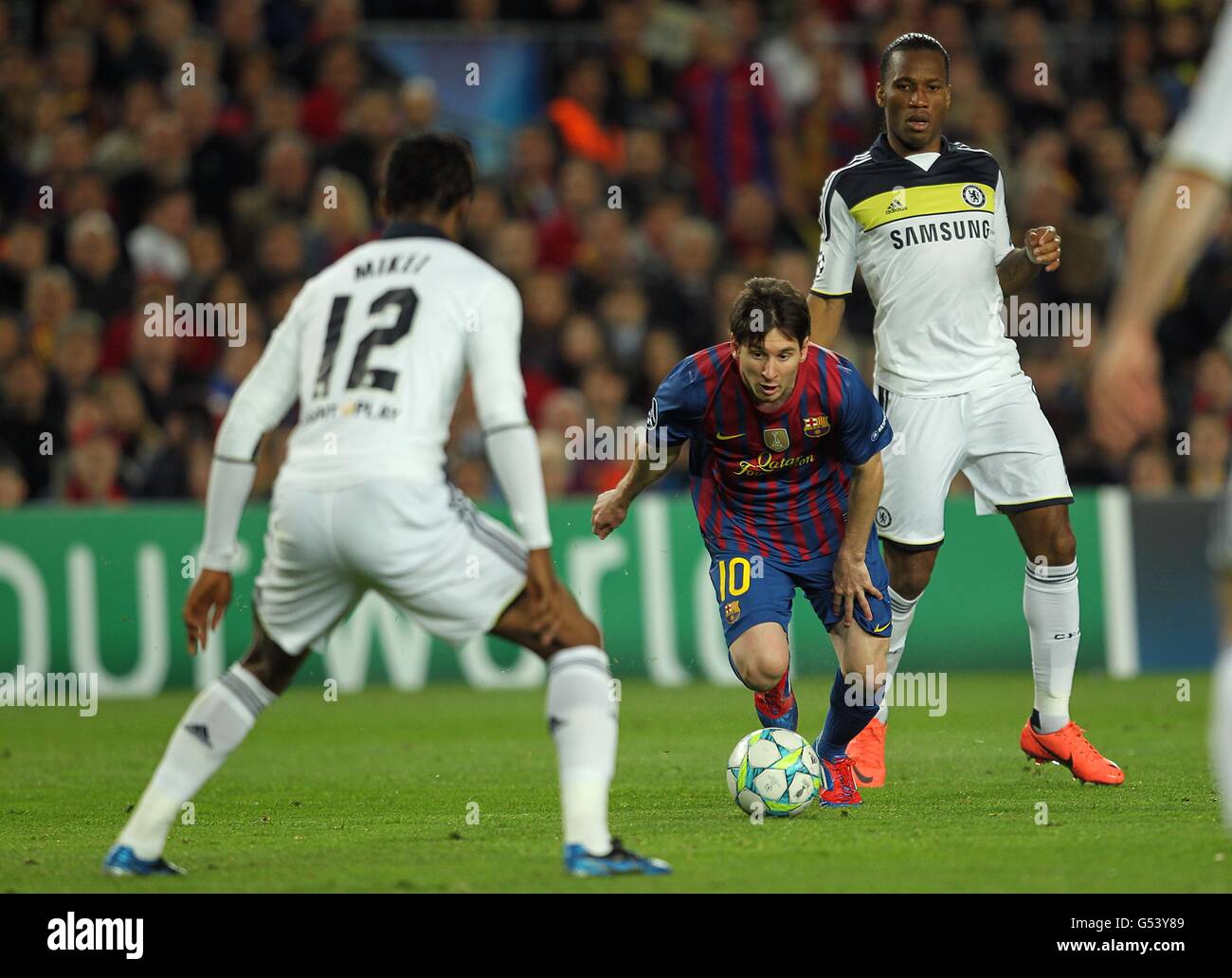 Barcelonas lionel messi runs at chelseas mikel hi-res stock photography ...