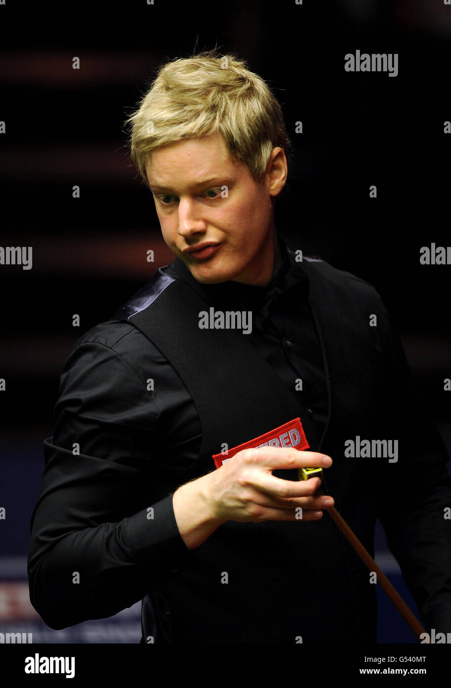 Australia's Neil Robertson chalks his cue during his match against ...