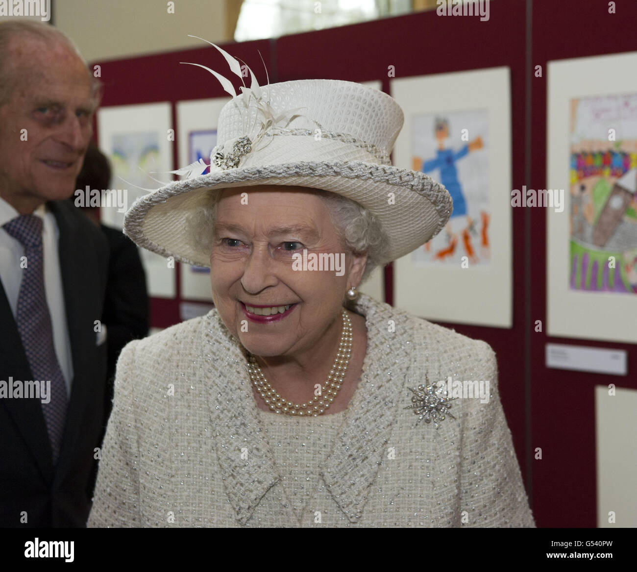 Queen Elizabeth II and the Duke of Edinburgh meet members of the Grand ...