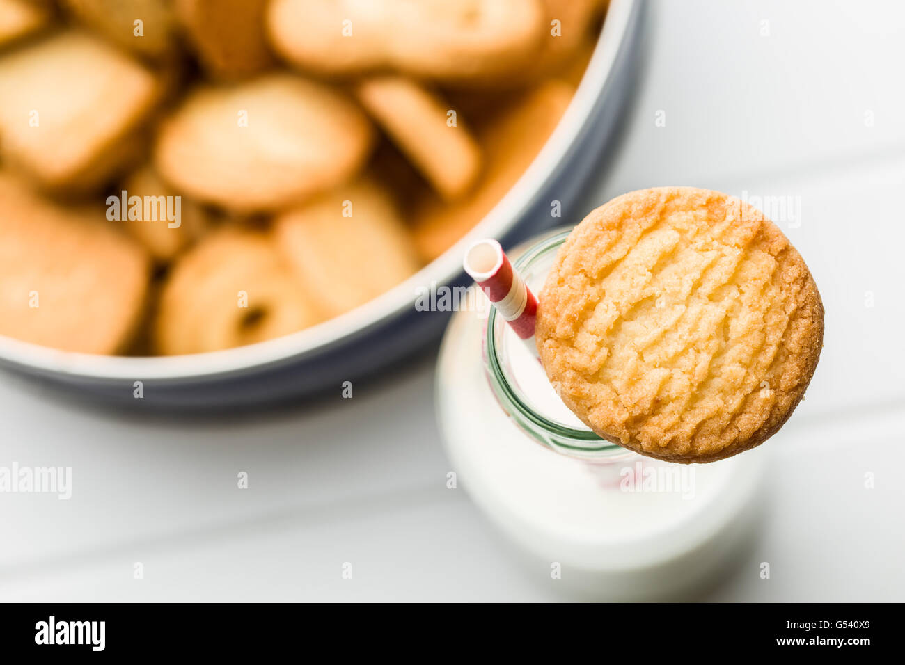 Sweet butter biscuits and fresh healthy milk in glass bottle Stock ...