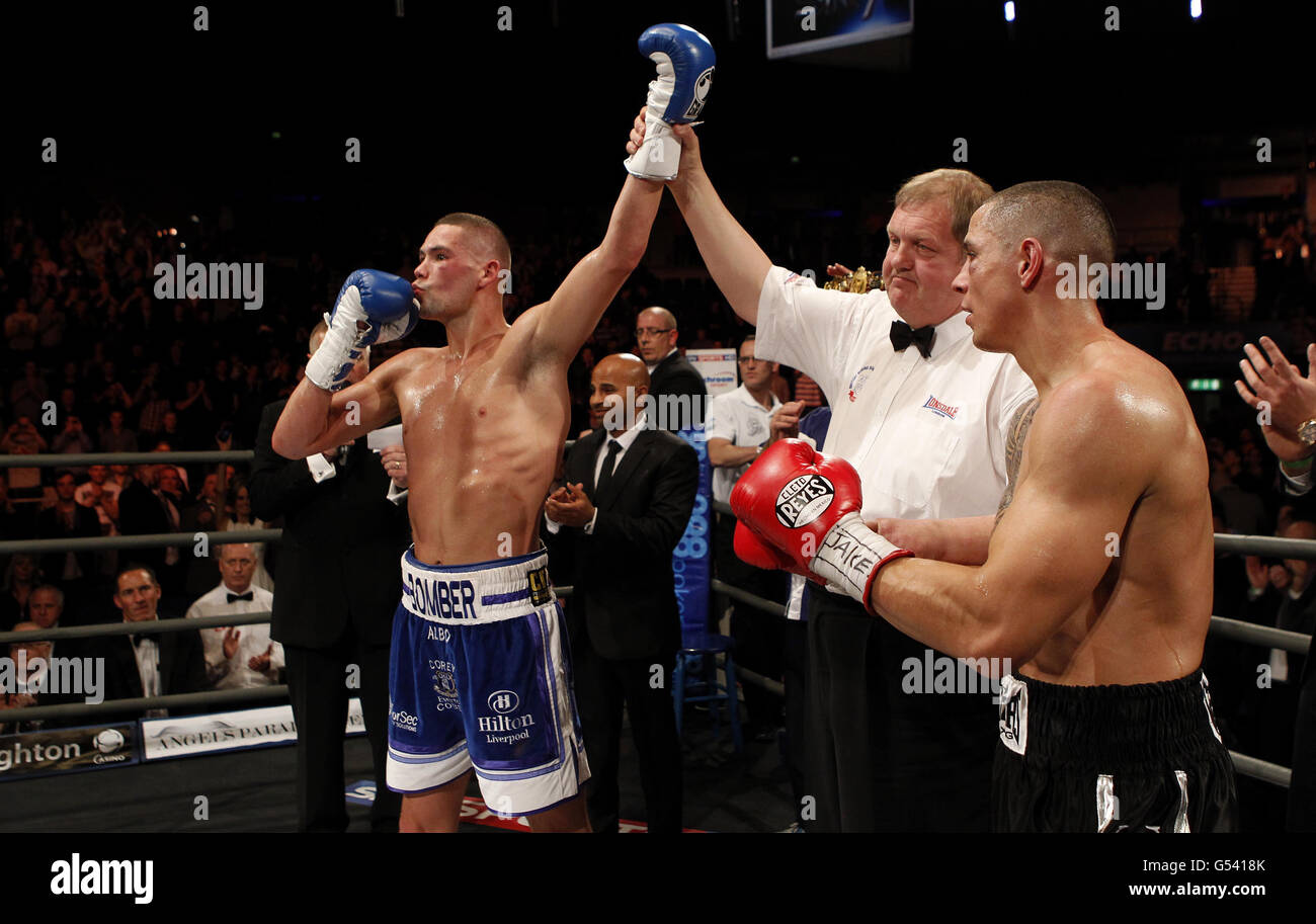 Tony Bellew (left) celebrates beating Danny McIntosh and retaining his ...