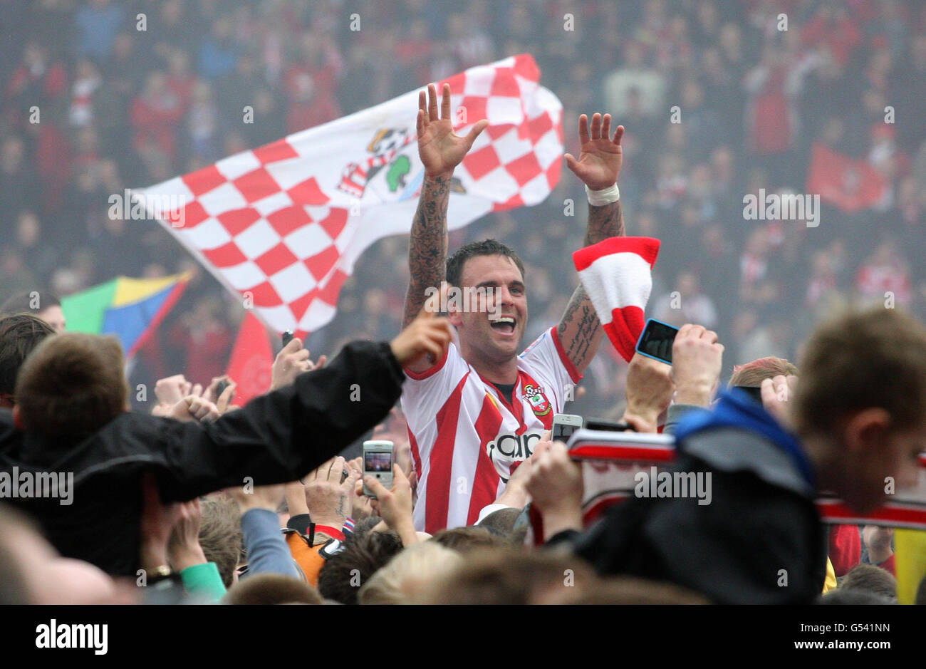 Southampton's Daniel Fox is carried off the pitch by jubilant fans at ...