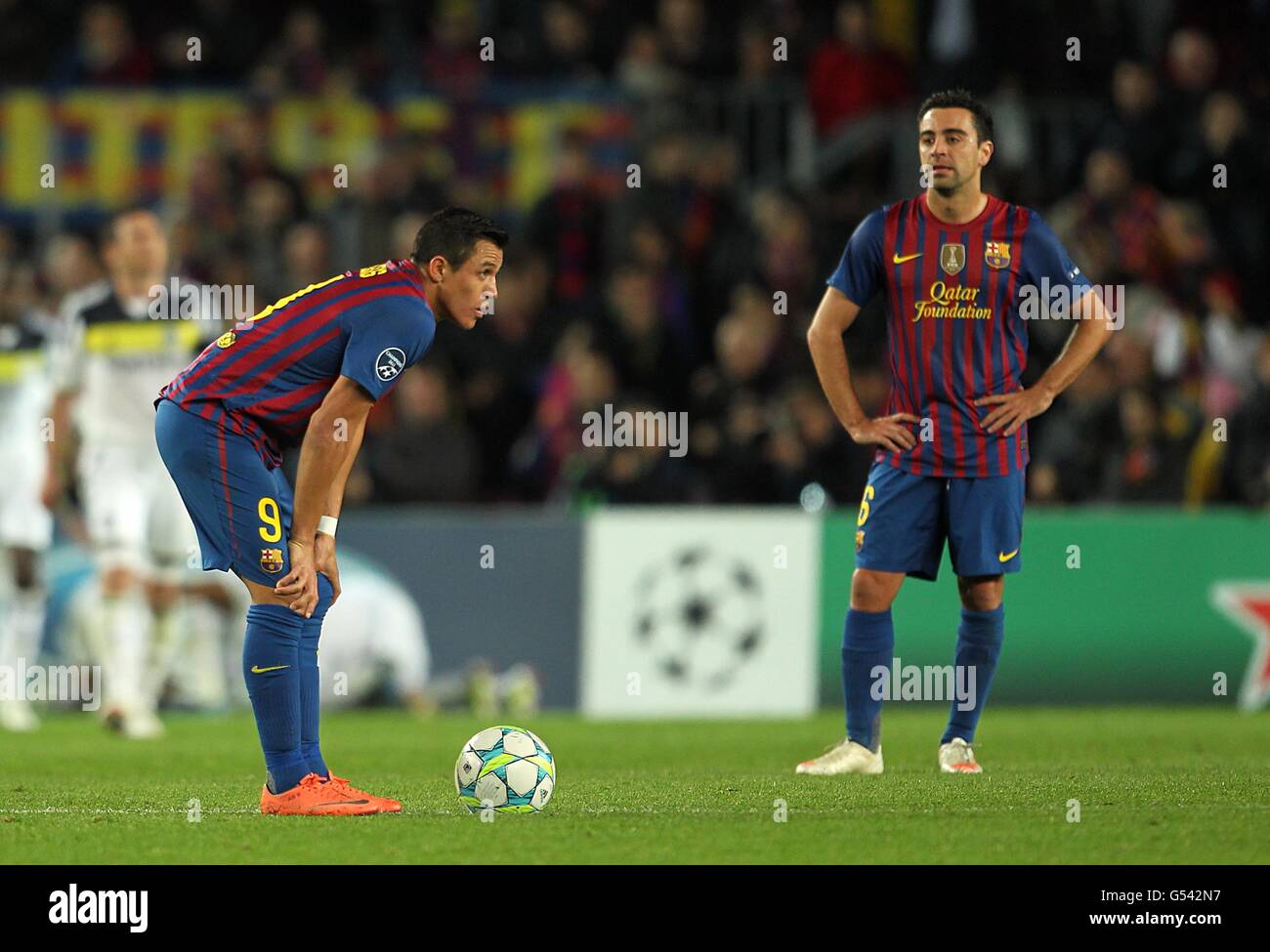 Barcelona's Hernandez Xavi (right) and Alexis Sanchez stand dejected ...