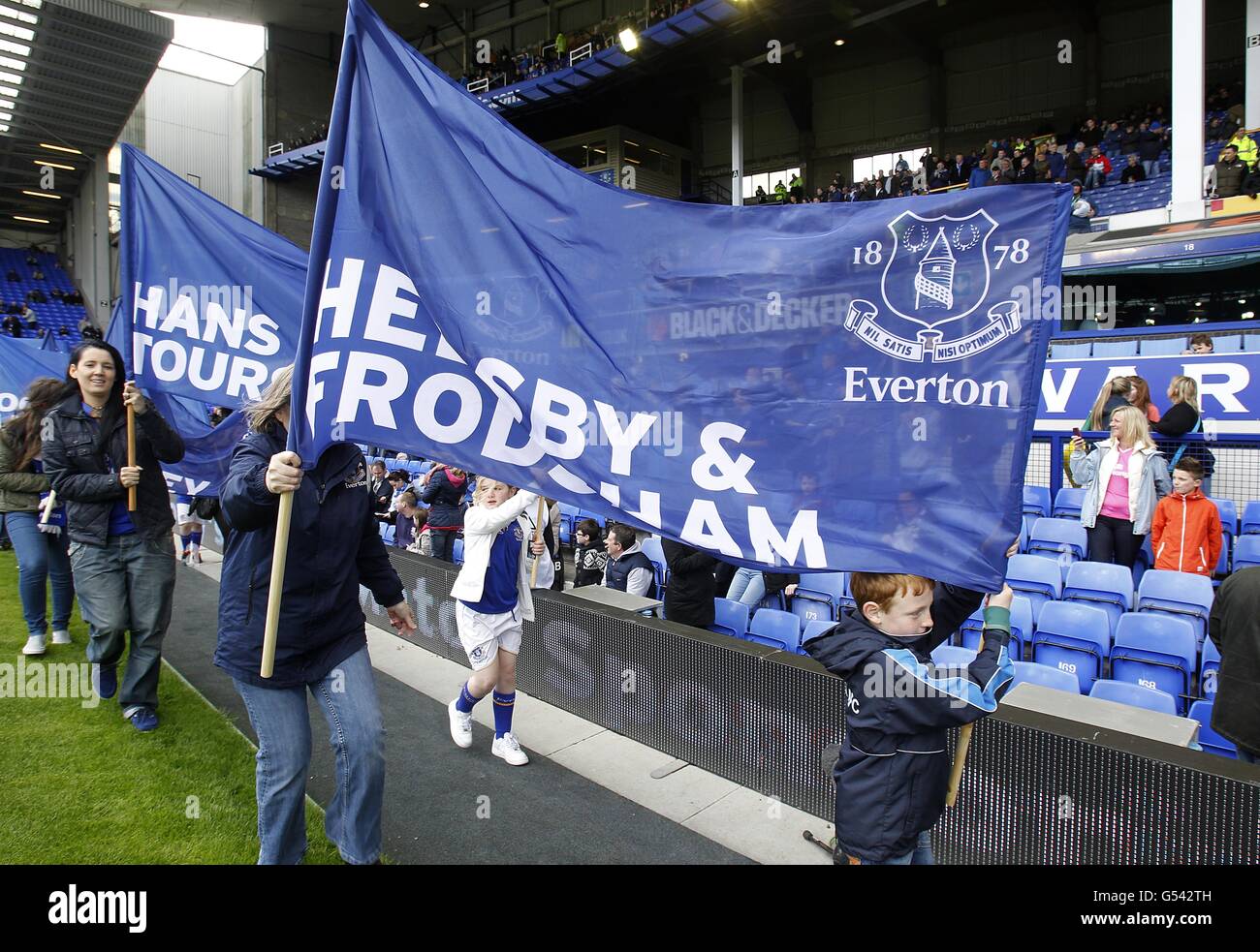 Everton's supporters club's parade their flags around the pitch Stock ...