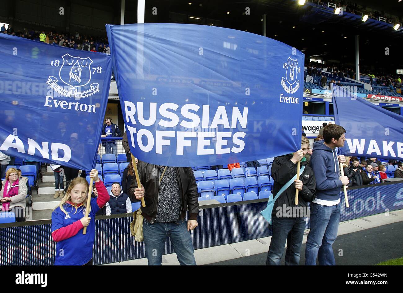 Everton's supporters club's parade their flags around the pitch Stock ...