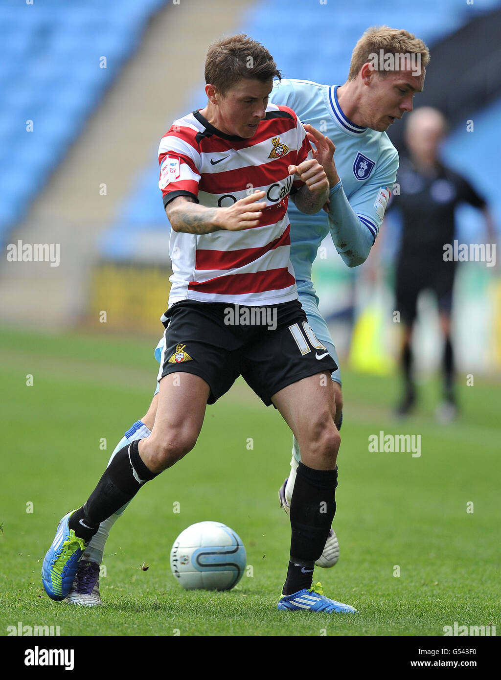 Coventry City's Chris Hussey and Doncaster Rovers John Oster battle for ...