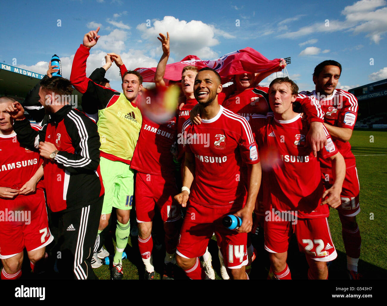 Swindon Town players celebrate promotion following the League Two match ...
