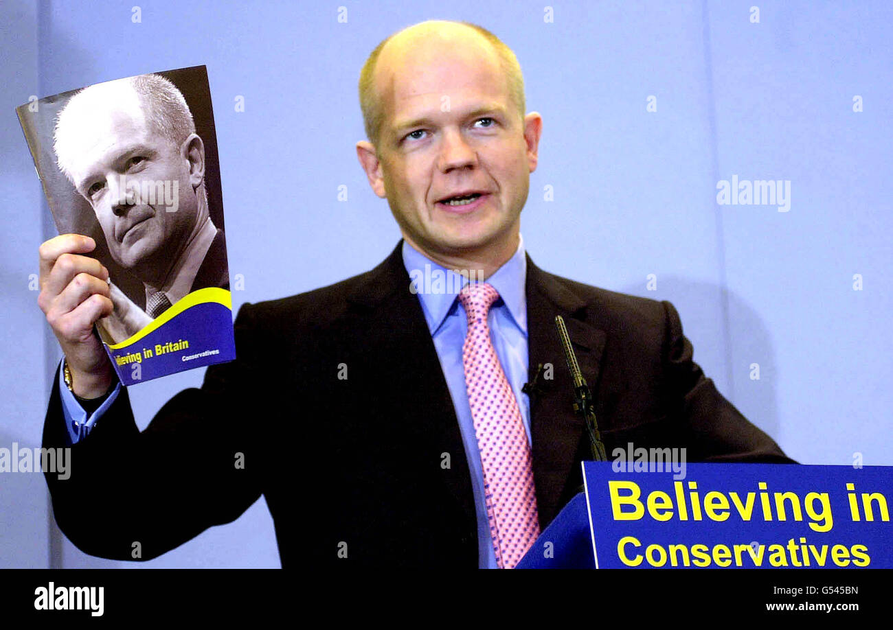 Conservative Party leader William Hague holds up Believing in Britain ...