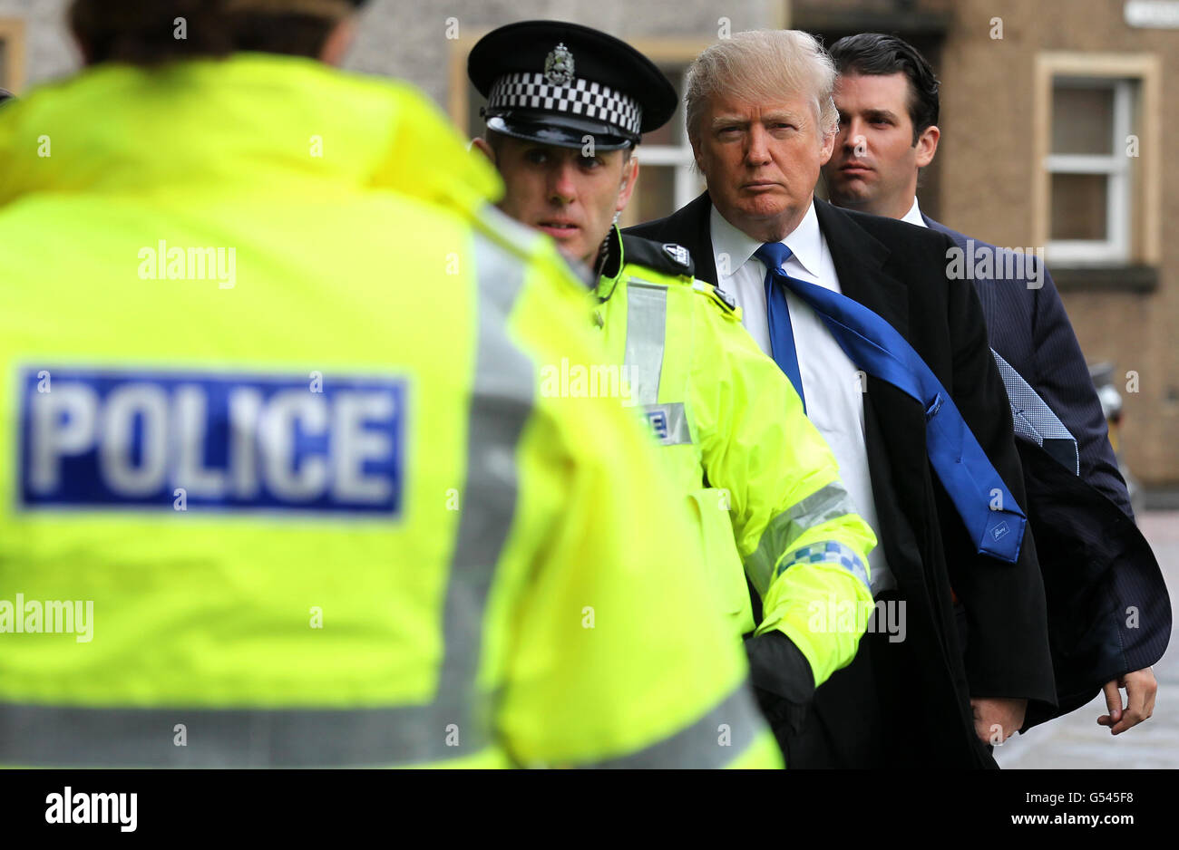 Donald Trump and Donald Trump Jnr arrive at the Scottish Parliament in ...
