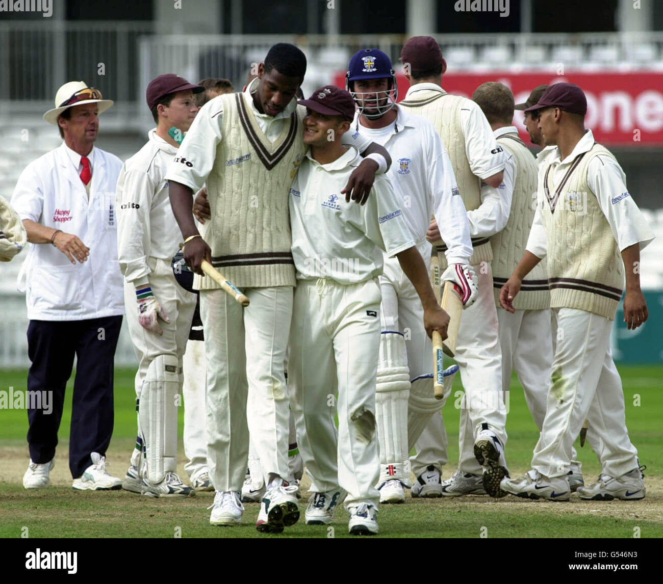 Surrey's Alex Tudor (left) and Mark Butcher leave the field after the ...