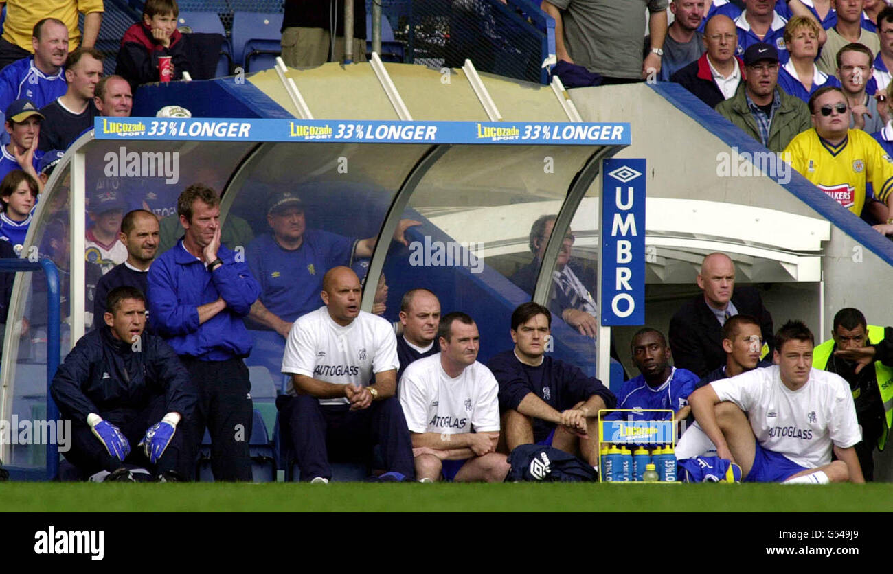 Club staff watch from the Chelsea dugout, during their FA Premiership ...