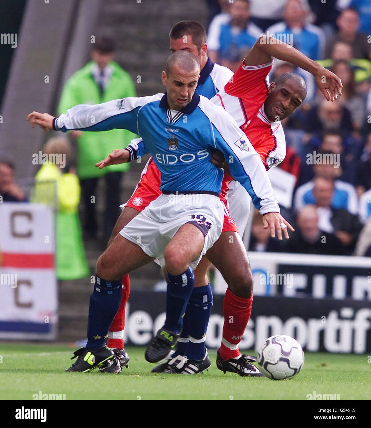 Manchester City's Paul Ritchie (front) holds off Middlesbrough striker ...