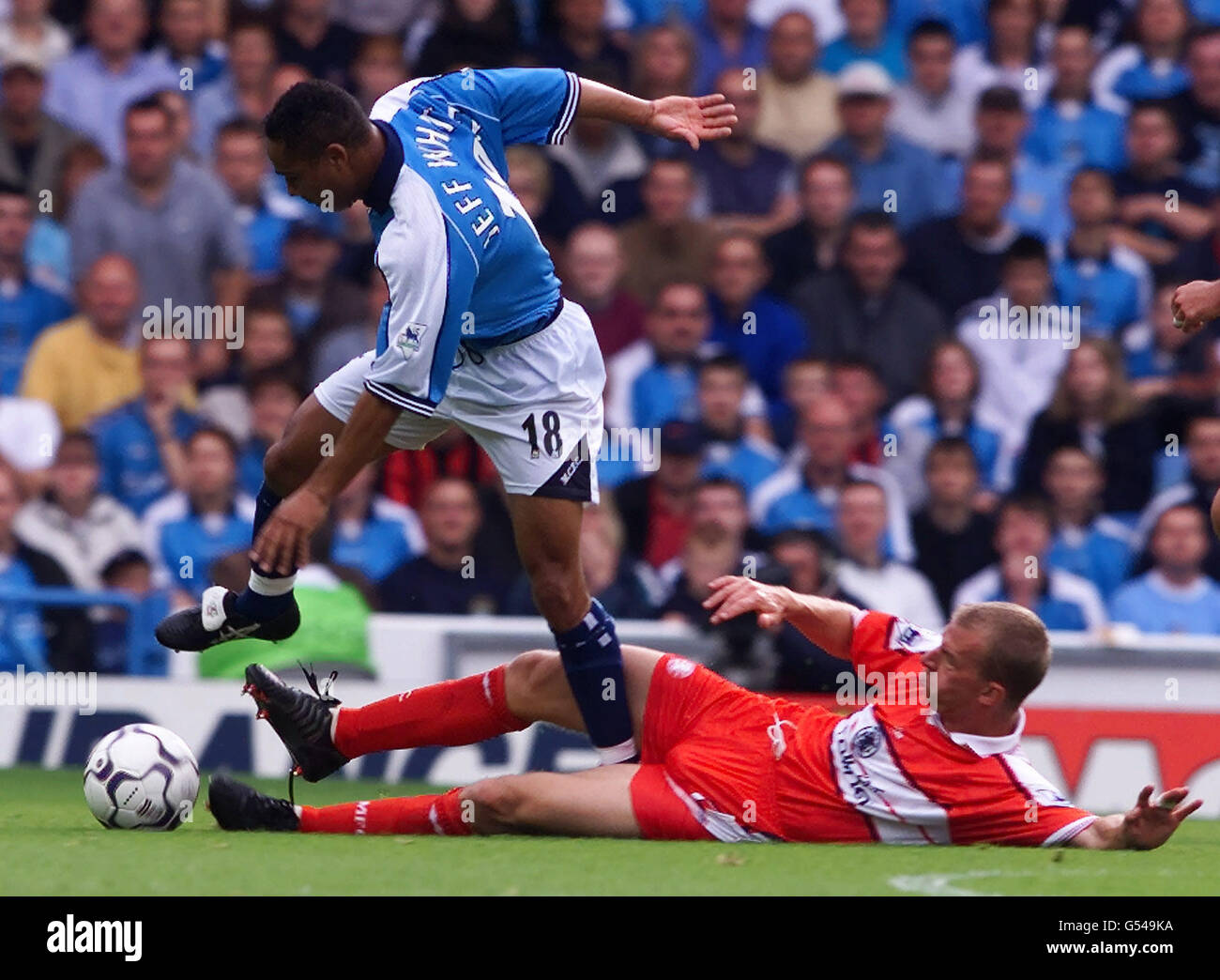 Manchester City's Jeff Whitley (left) rides a tackle from Middlesbrough ...