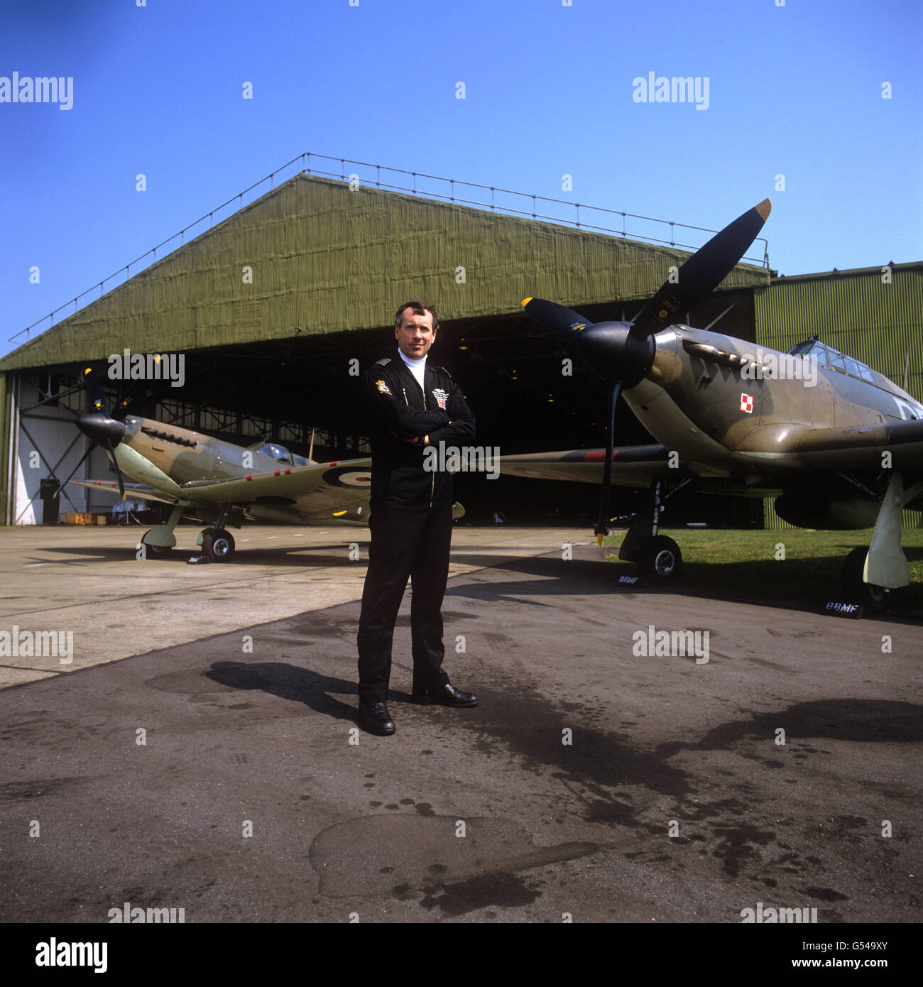Group Captain Martin Widdowson in front of two Spitfires at RAF ...