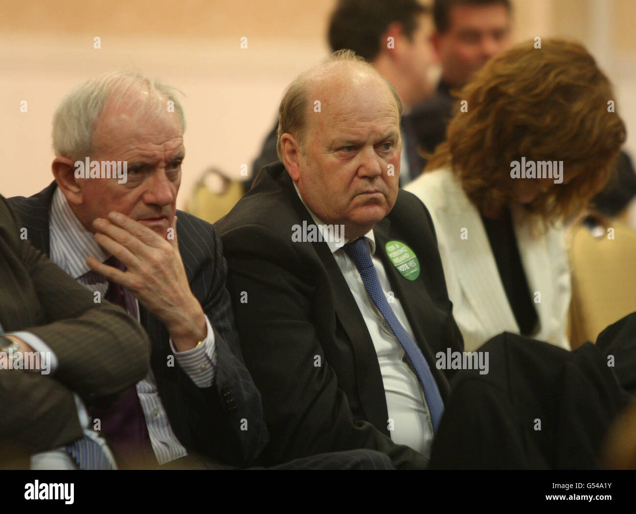 Finance Minister Michael Noonan (centre) listens as Fine Gael launch ...