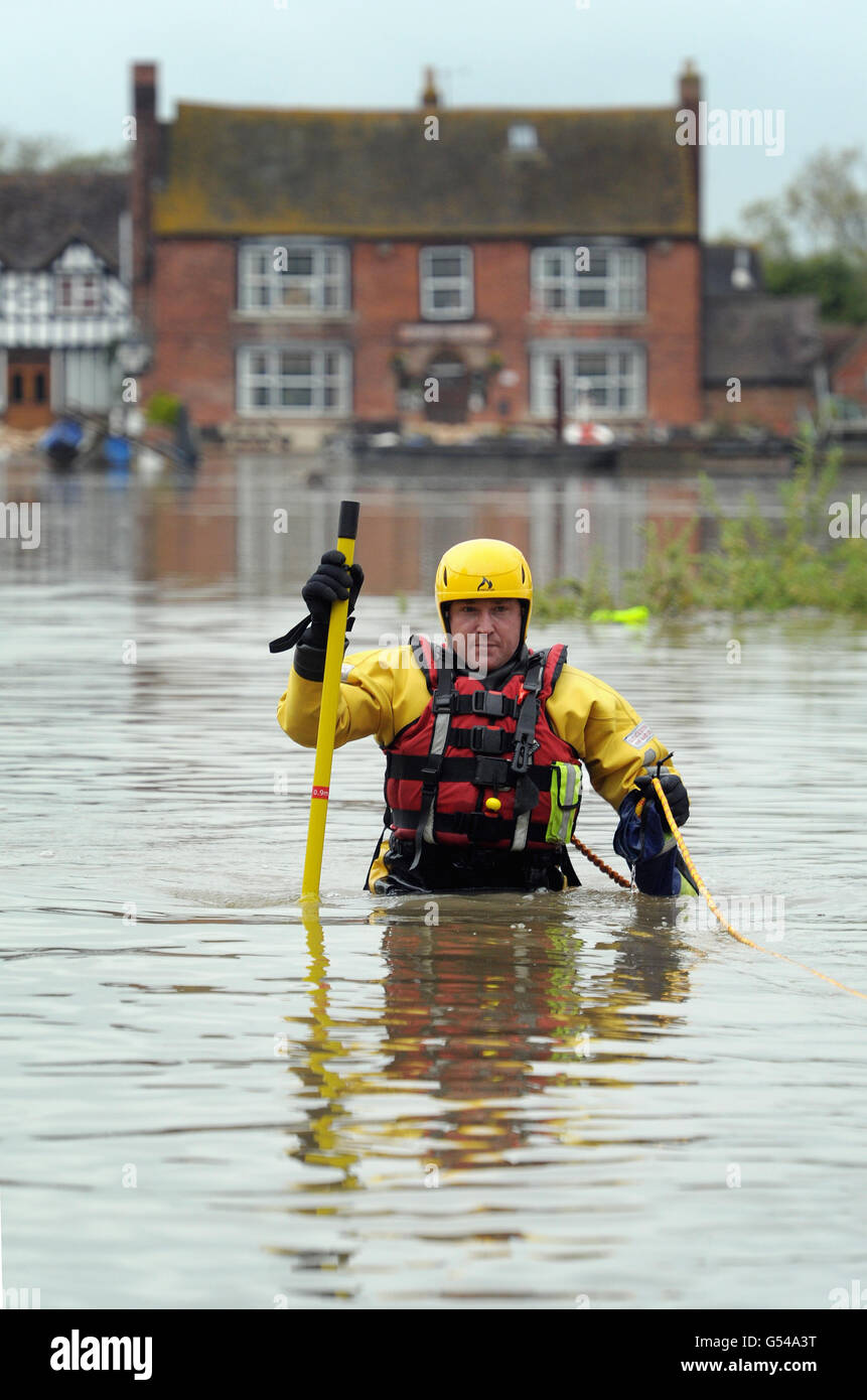 A member of a team from Gloucester Fire and Rescue service looks for ...