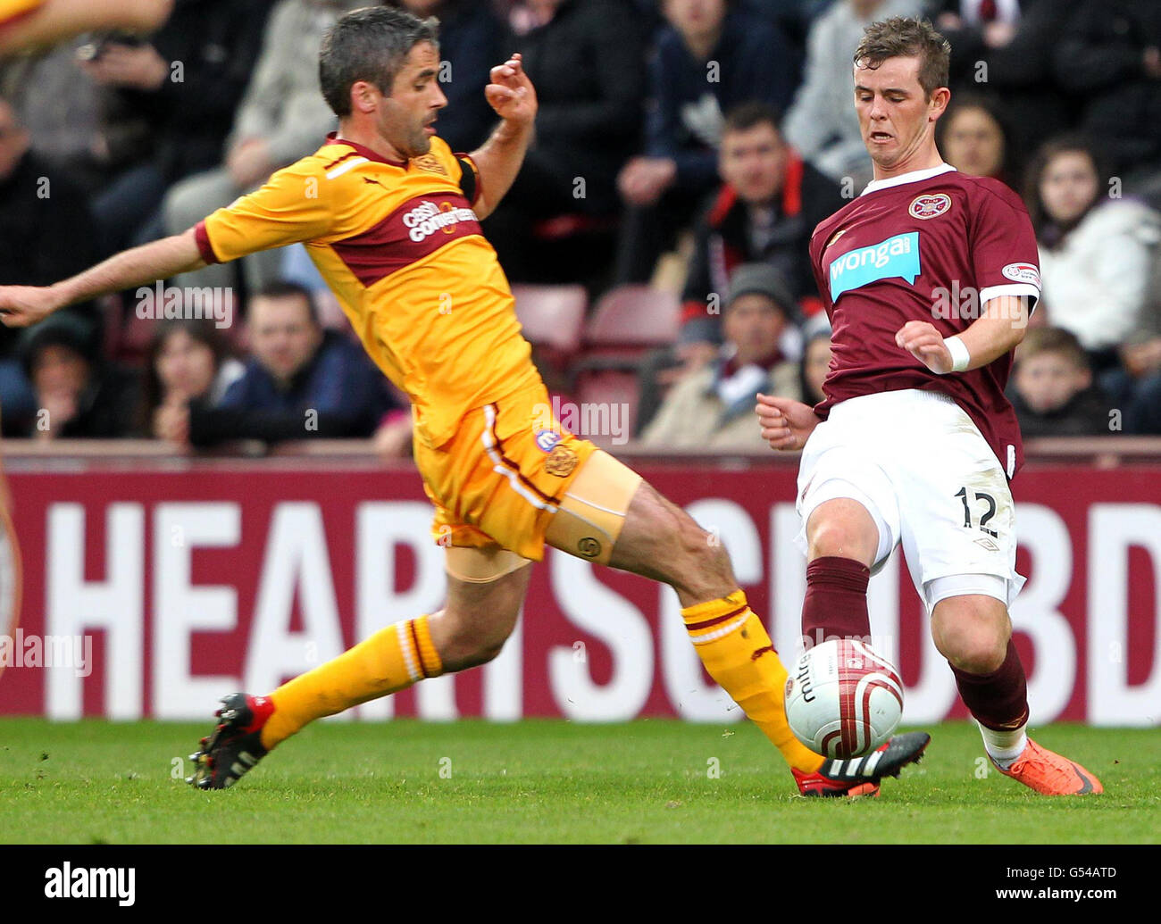 Hearts David Templeton challenges Motherwells Keith Lasley during the ...