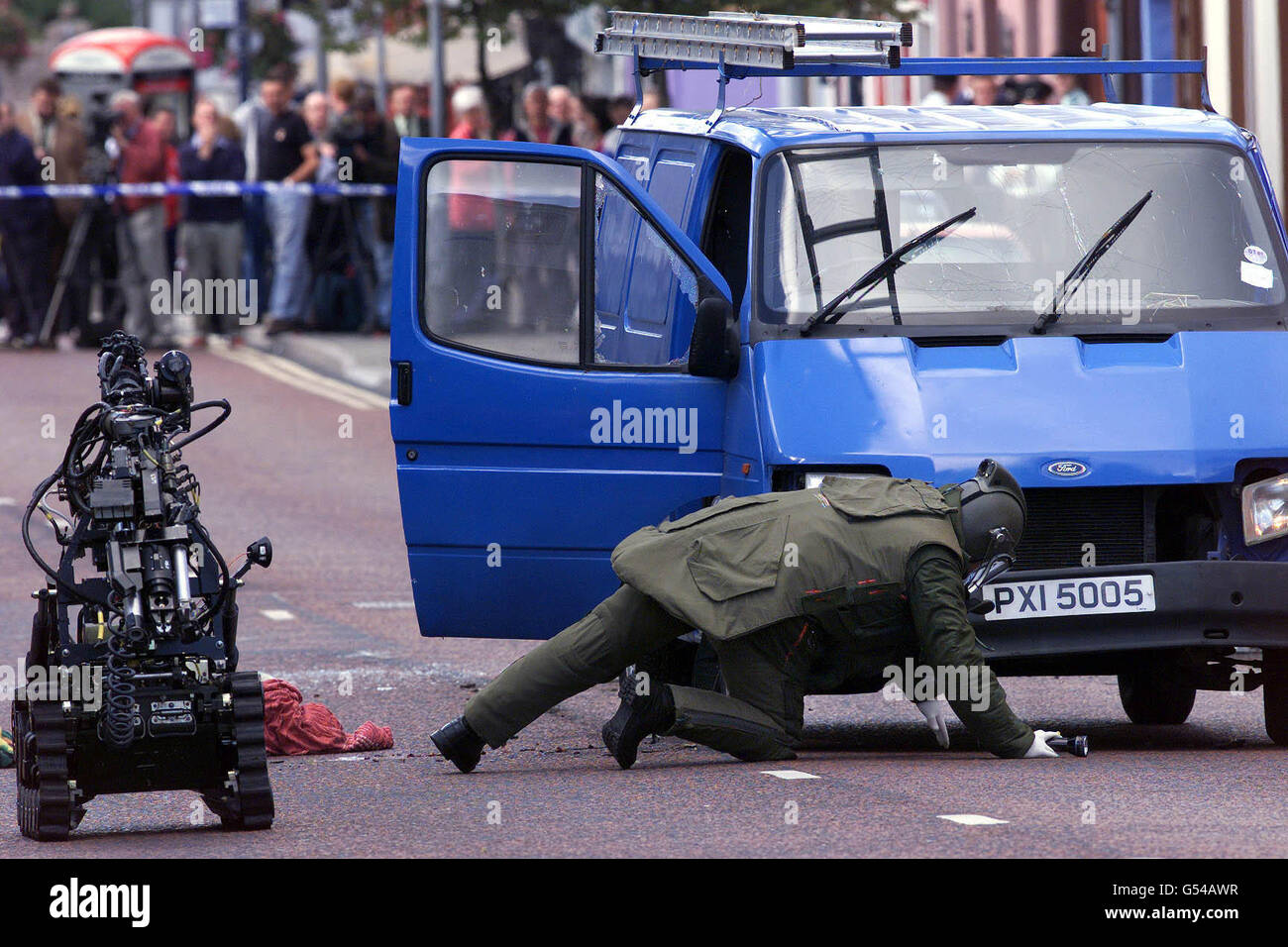 A British army bomb disposal expert examines the blue transit van in ...