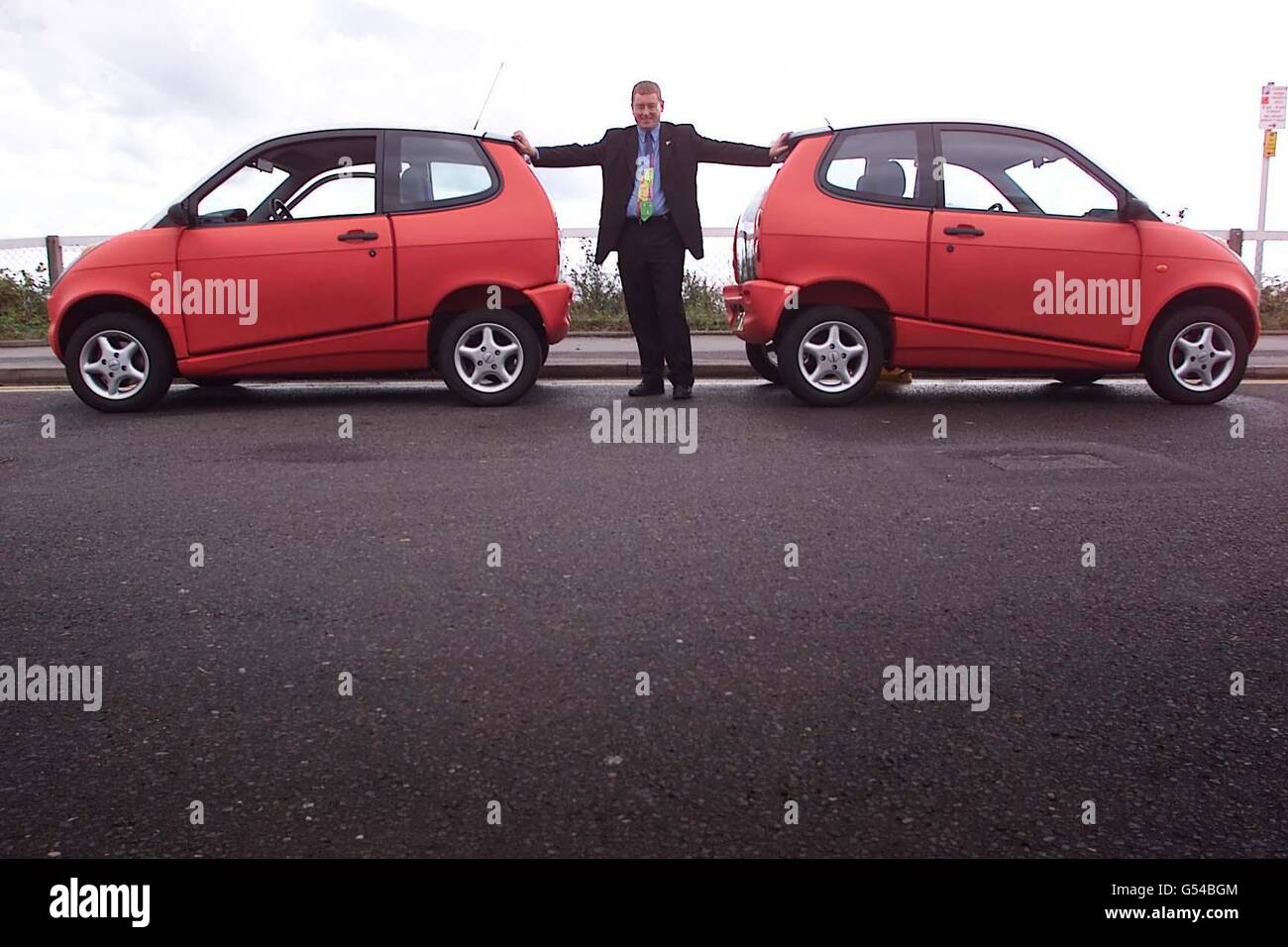 Welsh Assembly Member Peter Black with two battery powered Ford Think ...